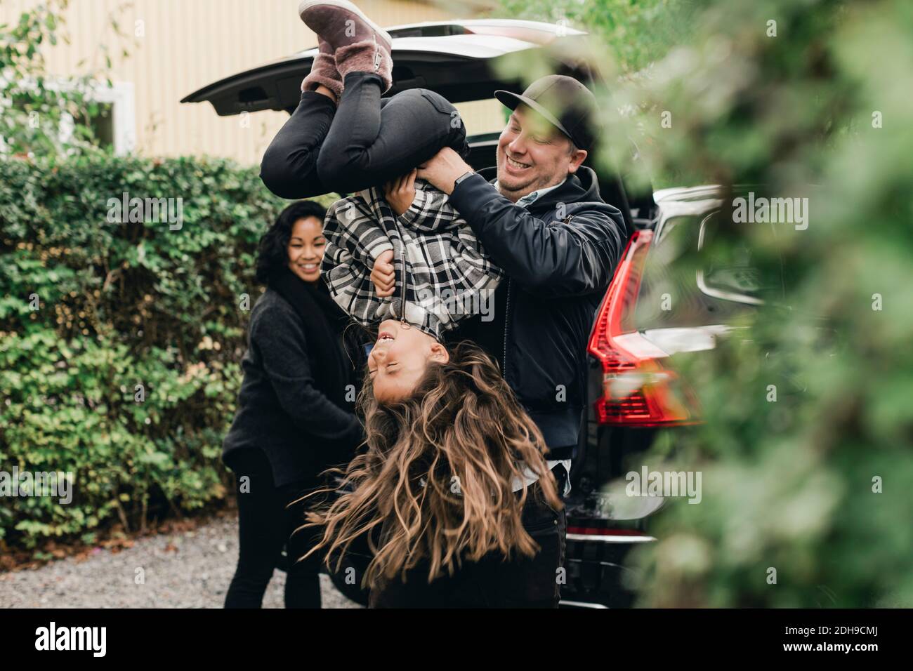 Playful father lifting daughter upside down Stock Photo - Alamy