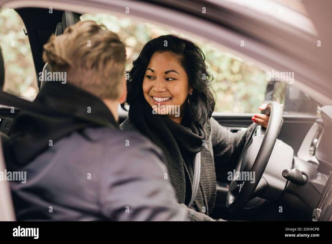 Woman looking over shoulder car hi-res stock photography and images - Alamy