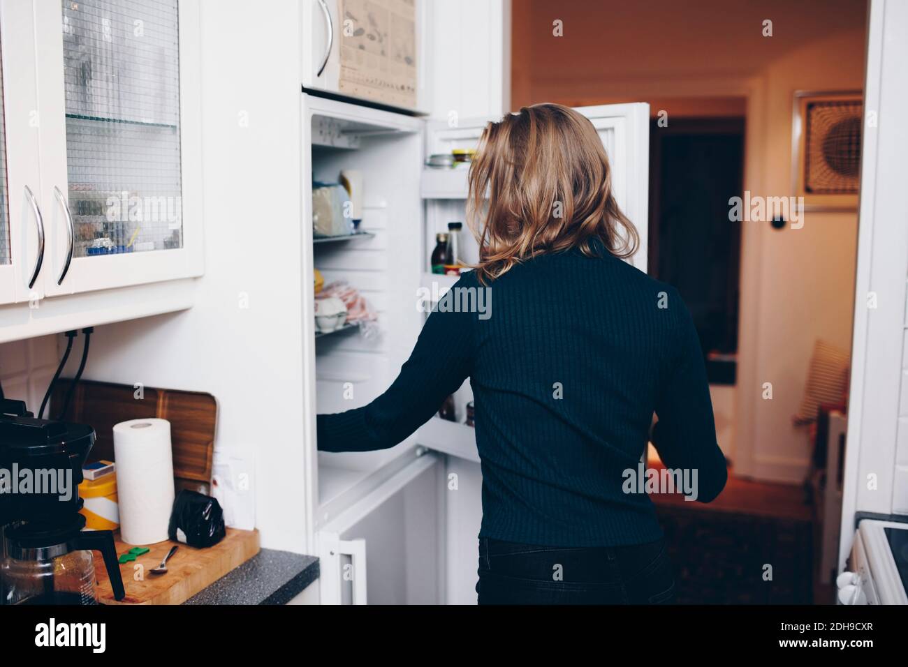 Person opening refrigerator hi-res stock photography and images - Alamy