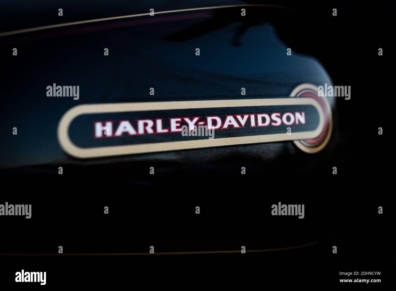 Harley Davidson logo on a motorcycle fuel tank shot at an outdoor rally ...