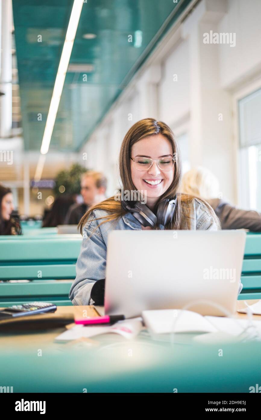 Smiling student laptop using hi-res stock photography and images - Alamy