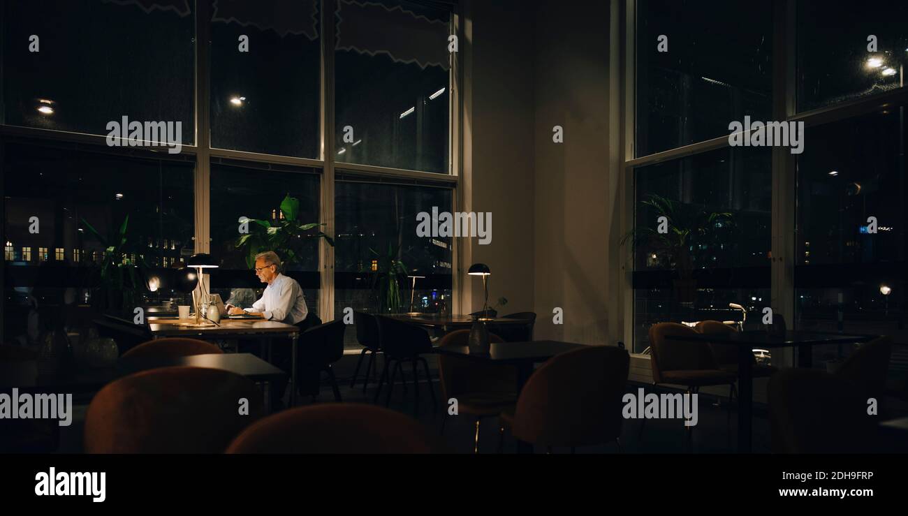 In dark late night office hi-res stock photography and images - Alamy