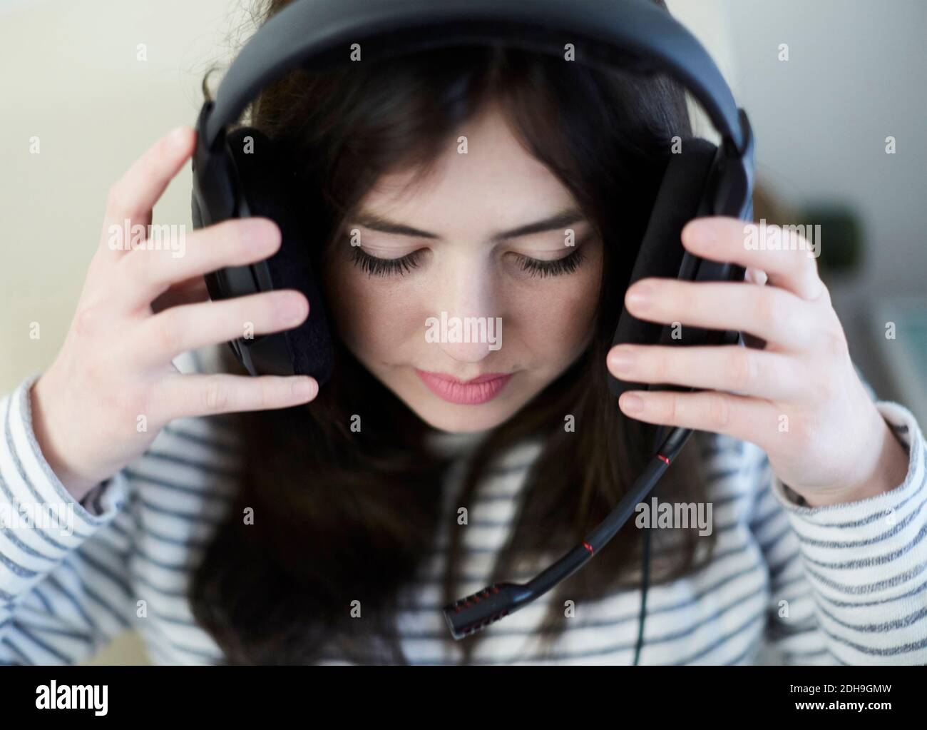 Young caucasian woman wearing headphones hi-res stock photography and ...