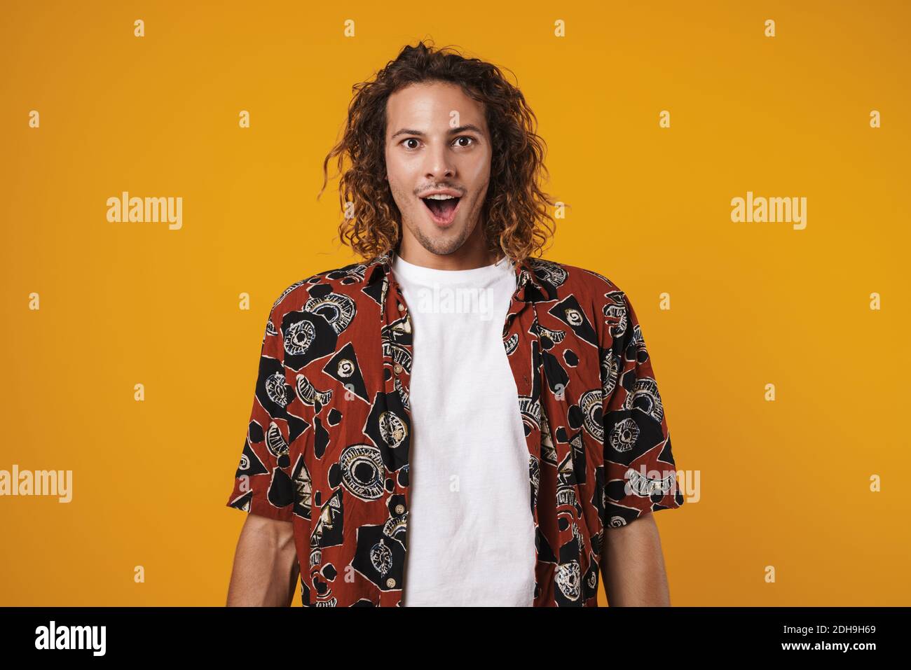 Photo of excited handsome guy expressing surprise on camera isolated ...