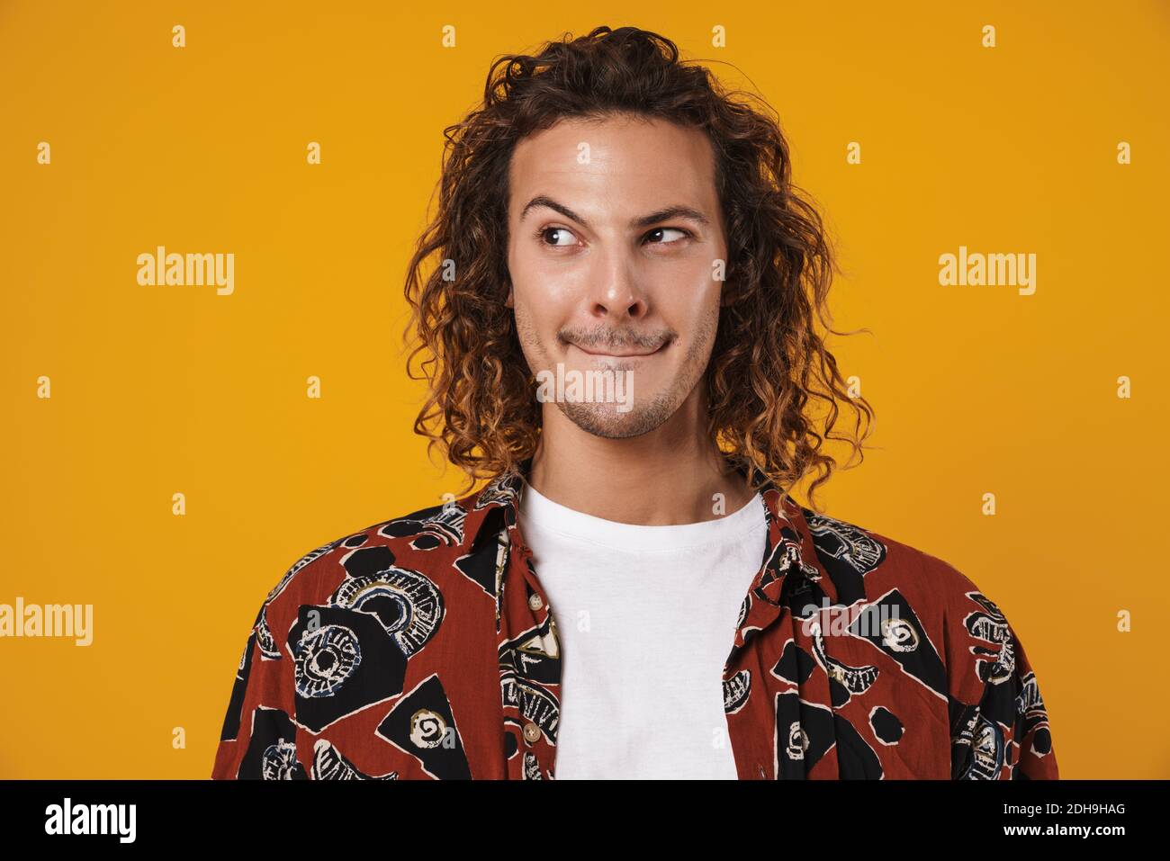 Photo of clever handsome guy thinking and looking aside isolated over ...