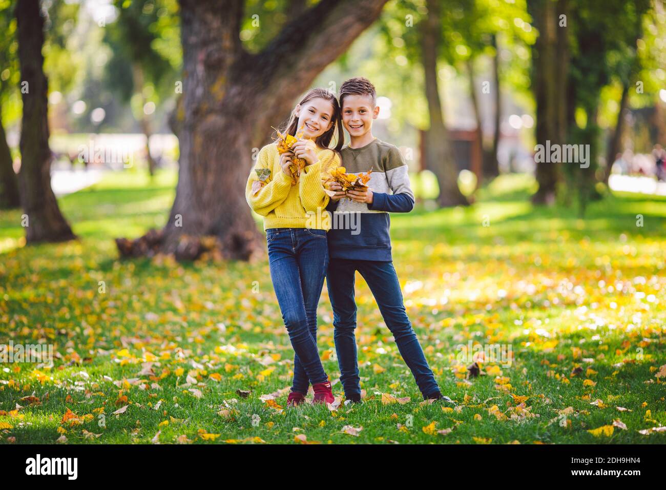 Friendship between siblings. Siblings together outside with bright ...
