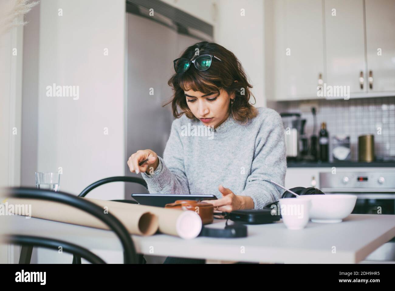 Woman working from home kitchen tablet hi-res stock photography and ...