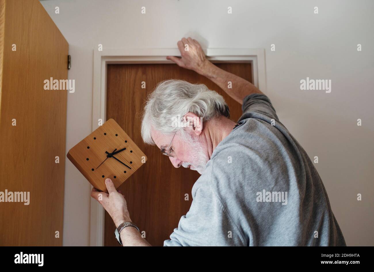 Man looking clock door hi-res stock photography and images - Alamy