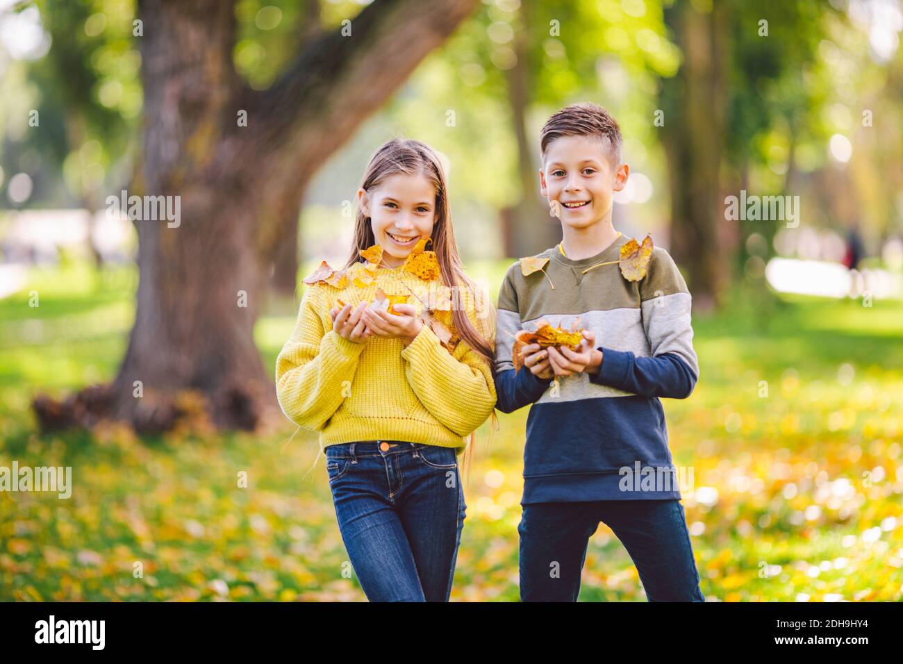 Friendship between siblings. Siblings together outside with bright ...