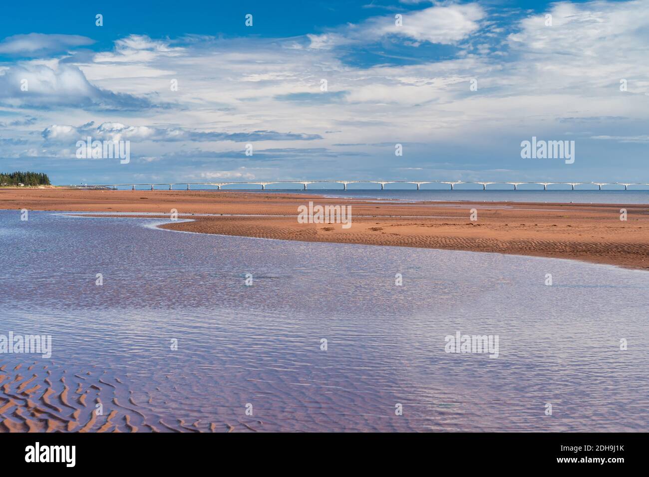 South shore Prince Edward Island beach with the Confederation Bridge at ...
