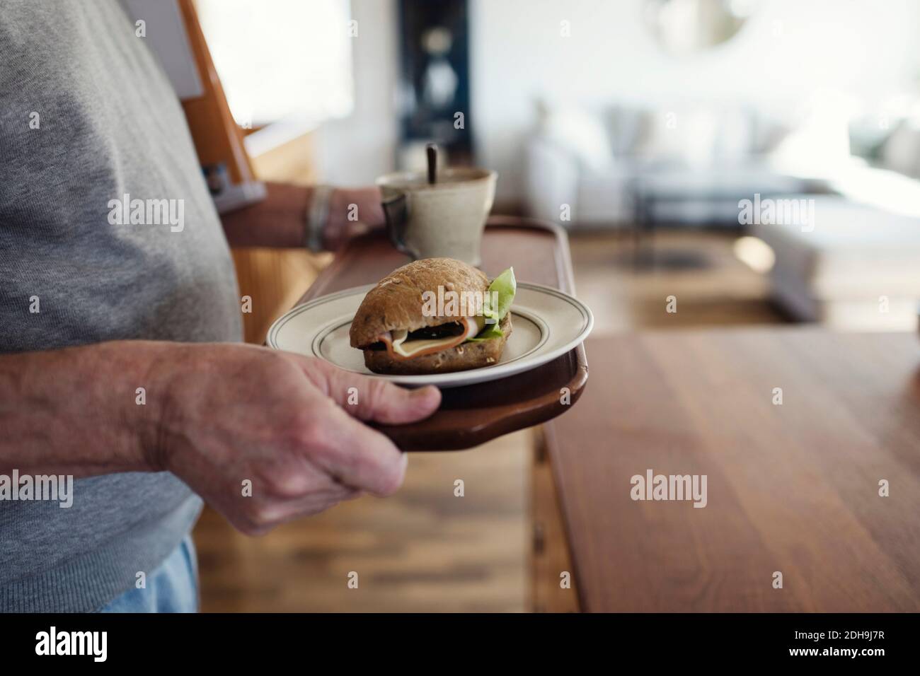 Man eating sandwich standing hi-res stock photography and images - Alamy