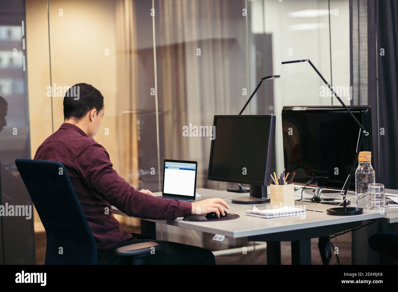 Working on laptop desktop computer hi-res stock photography and images ...