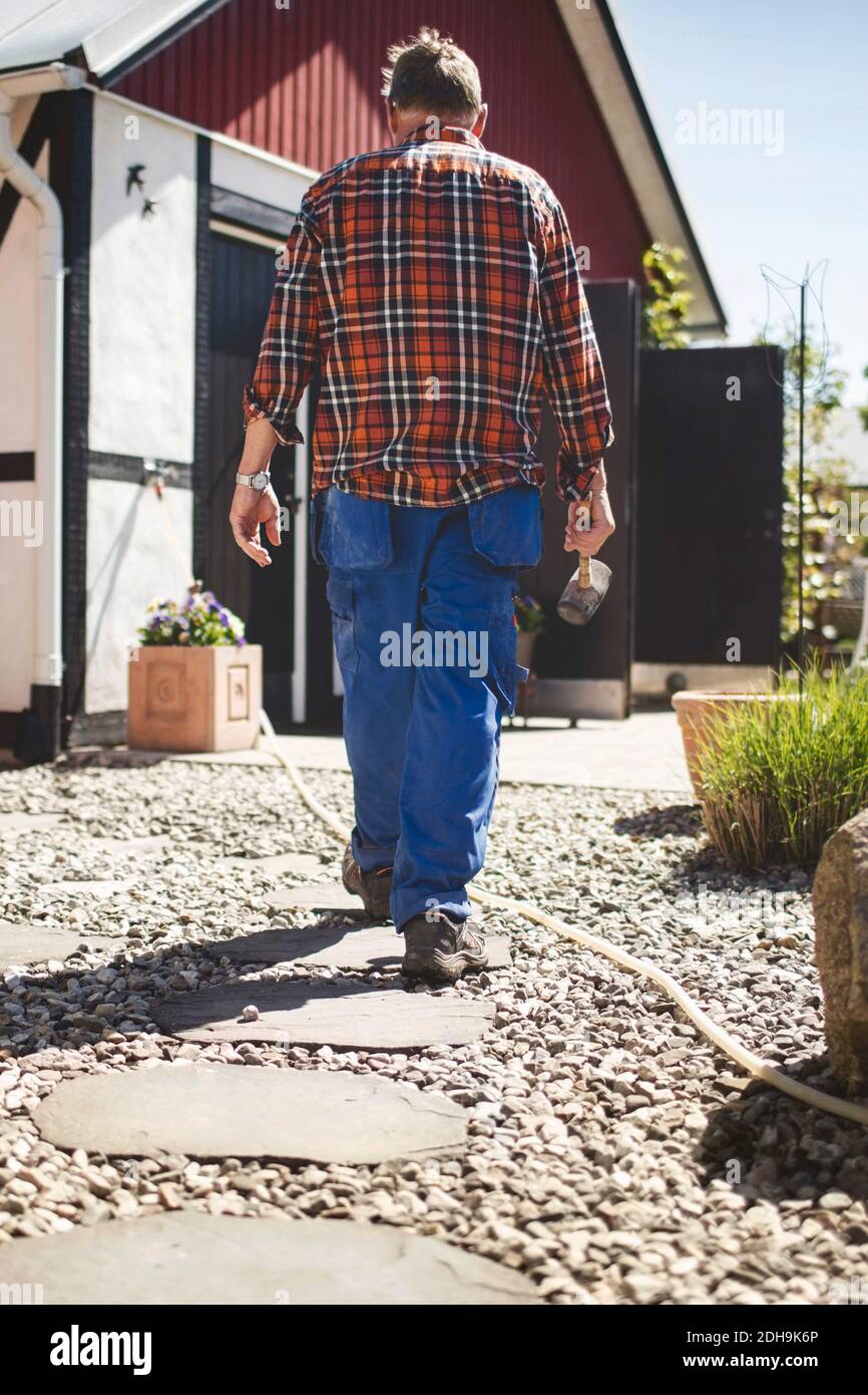 Man with hammer hi-res stock photography and images - Alamy