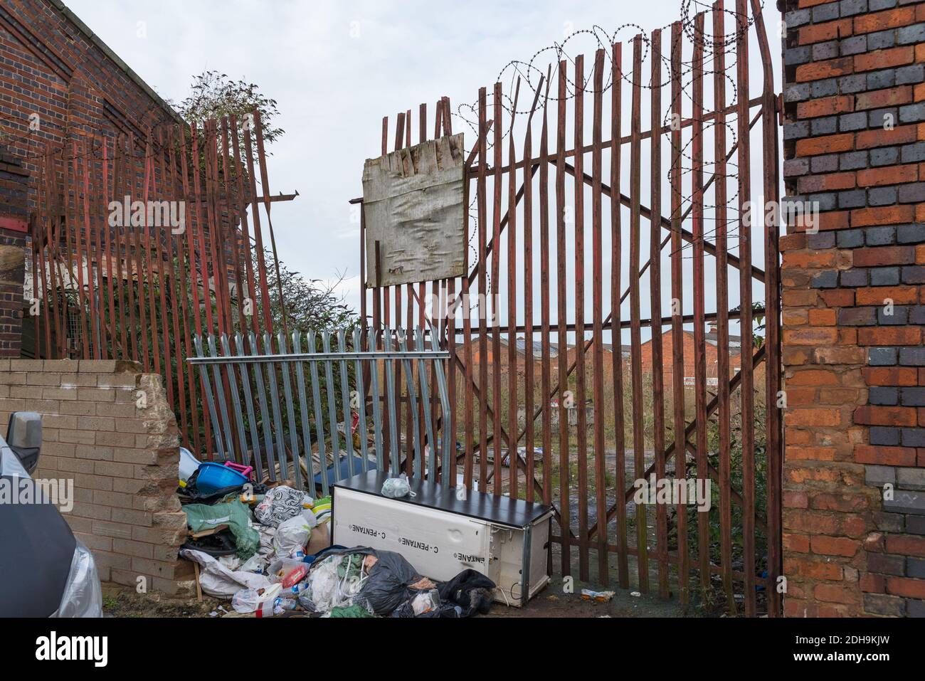 Derelict factories and fly tipped rubbish line Abberley Street in Cape ...