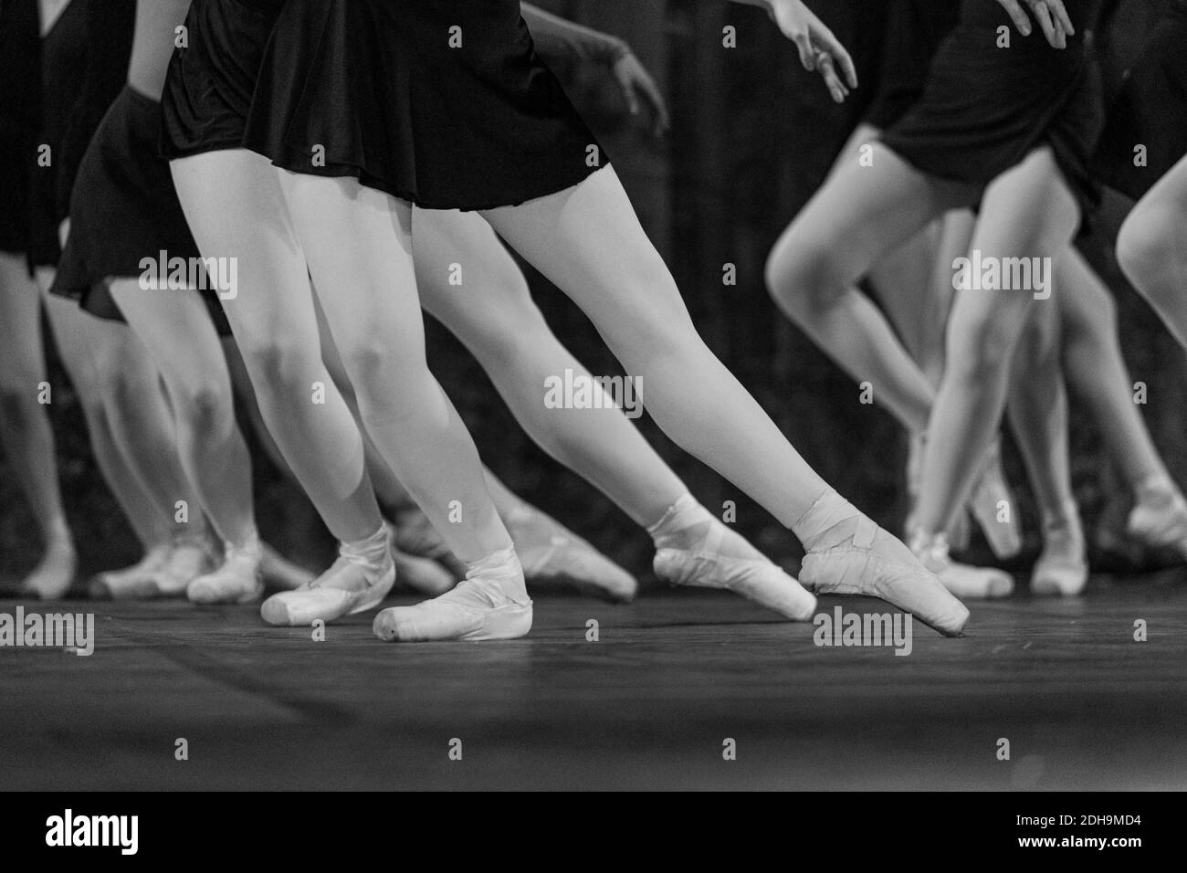 A grayscale closeup shot of ballet performers on stage Stock Photo - Alamy
