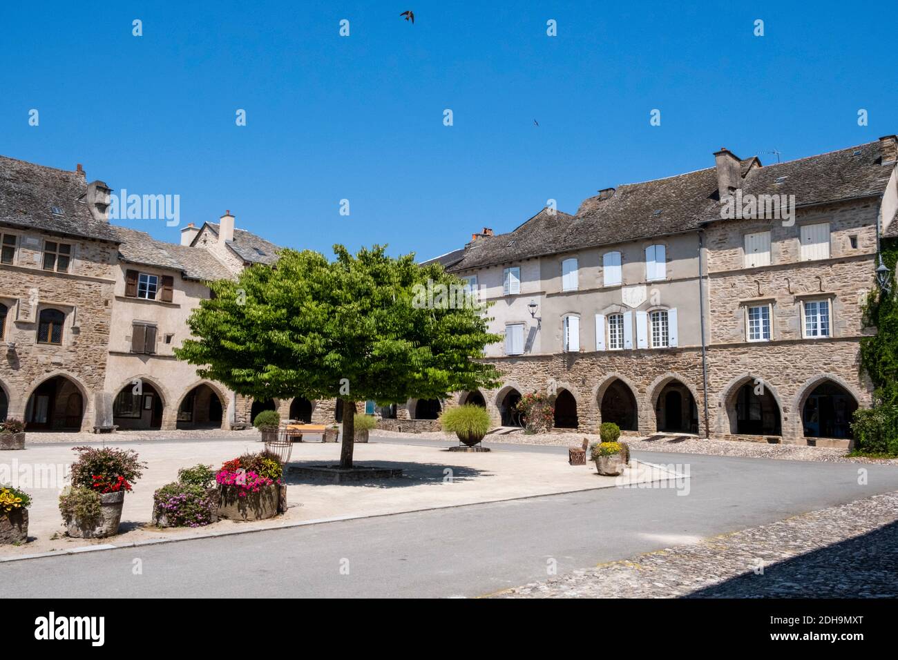 Sauveterre-de-Rouergue (south of France): traditional houses in “place ...