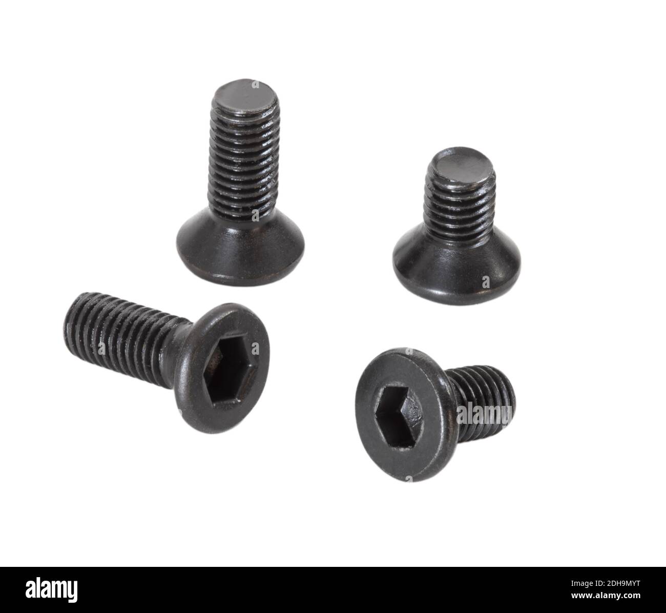 Four small and black bolts isolated on white Stock Photo - Alamy