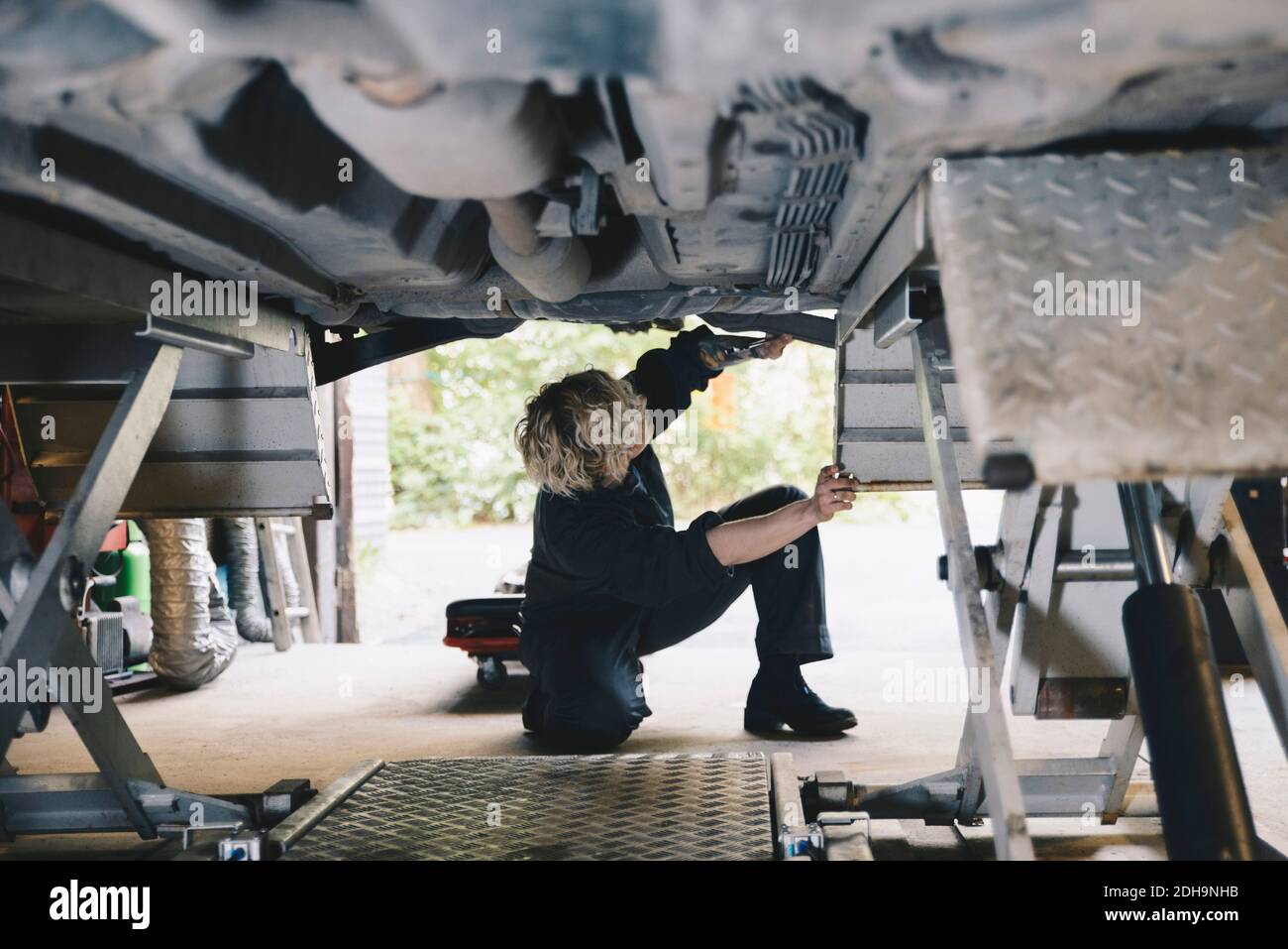 Mechanic under car on hi-res stock photography and images - Alamy