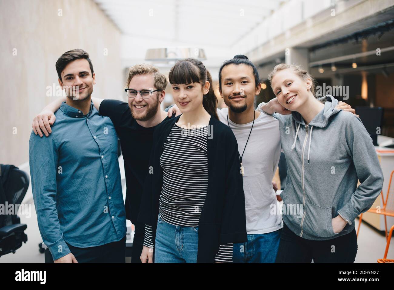 Group portrait of confident male and female computer programmers ...