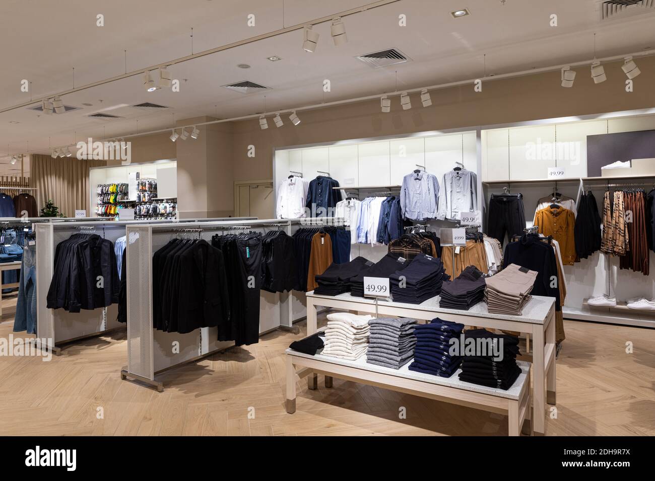 Modern fashionable brand interior of clothing store inside shopping ...