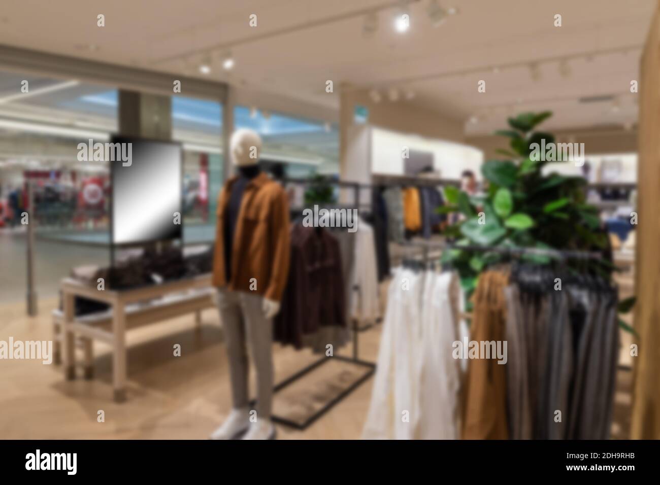 blur photo: luxury and fashionable brand new interior of cloth store ...