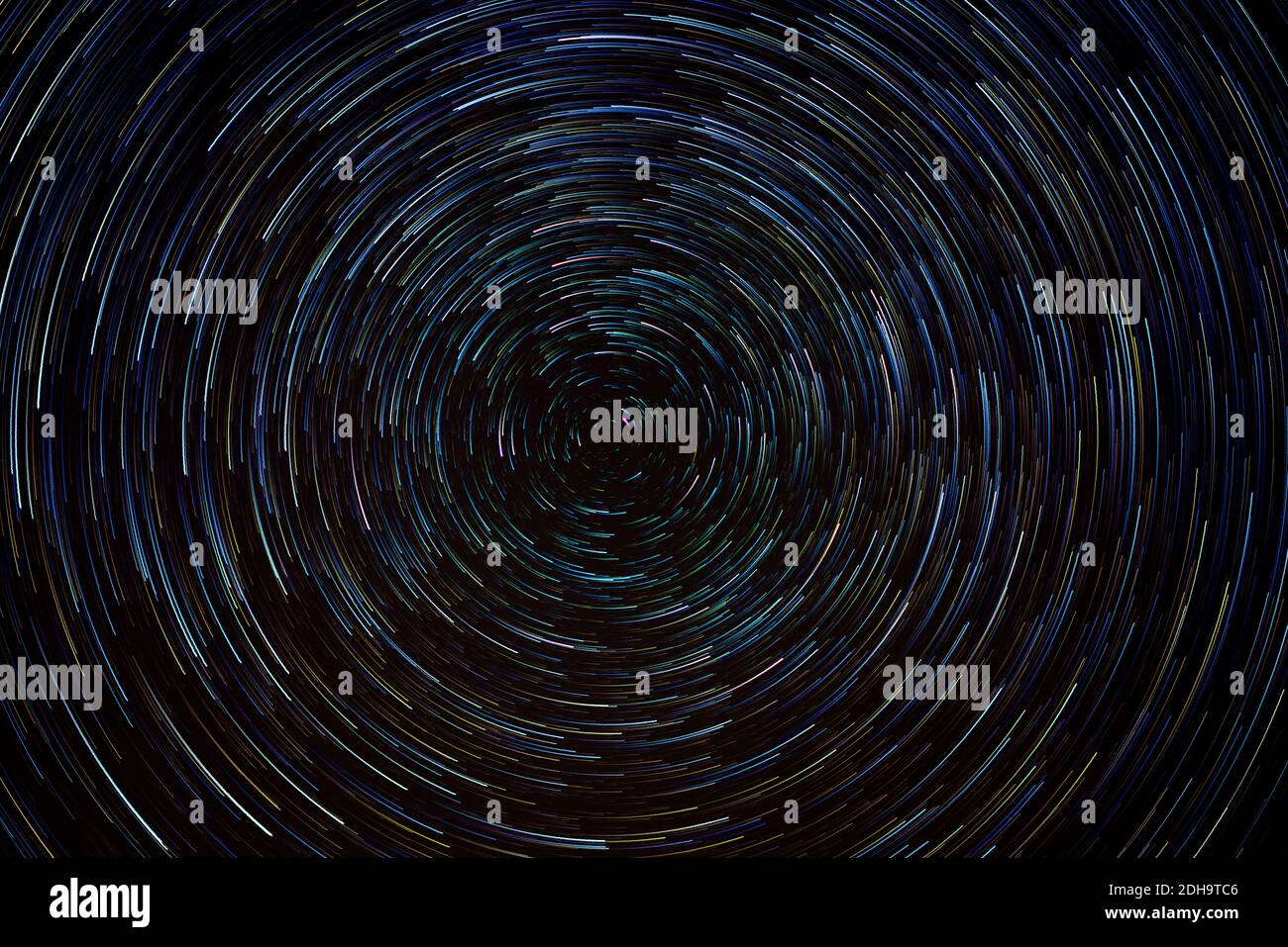 Colorful star trails with comet tails swirling around polaris Stock ...