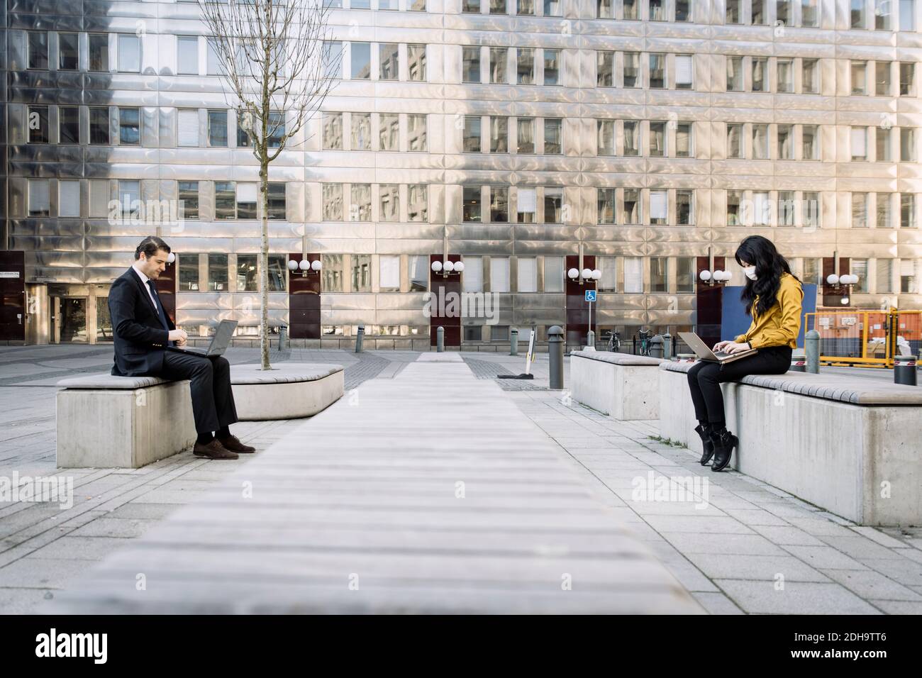 Business people keeping distance working outdoors Stock Photo - Alamy