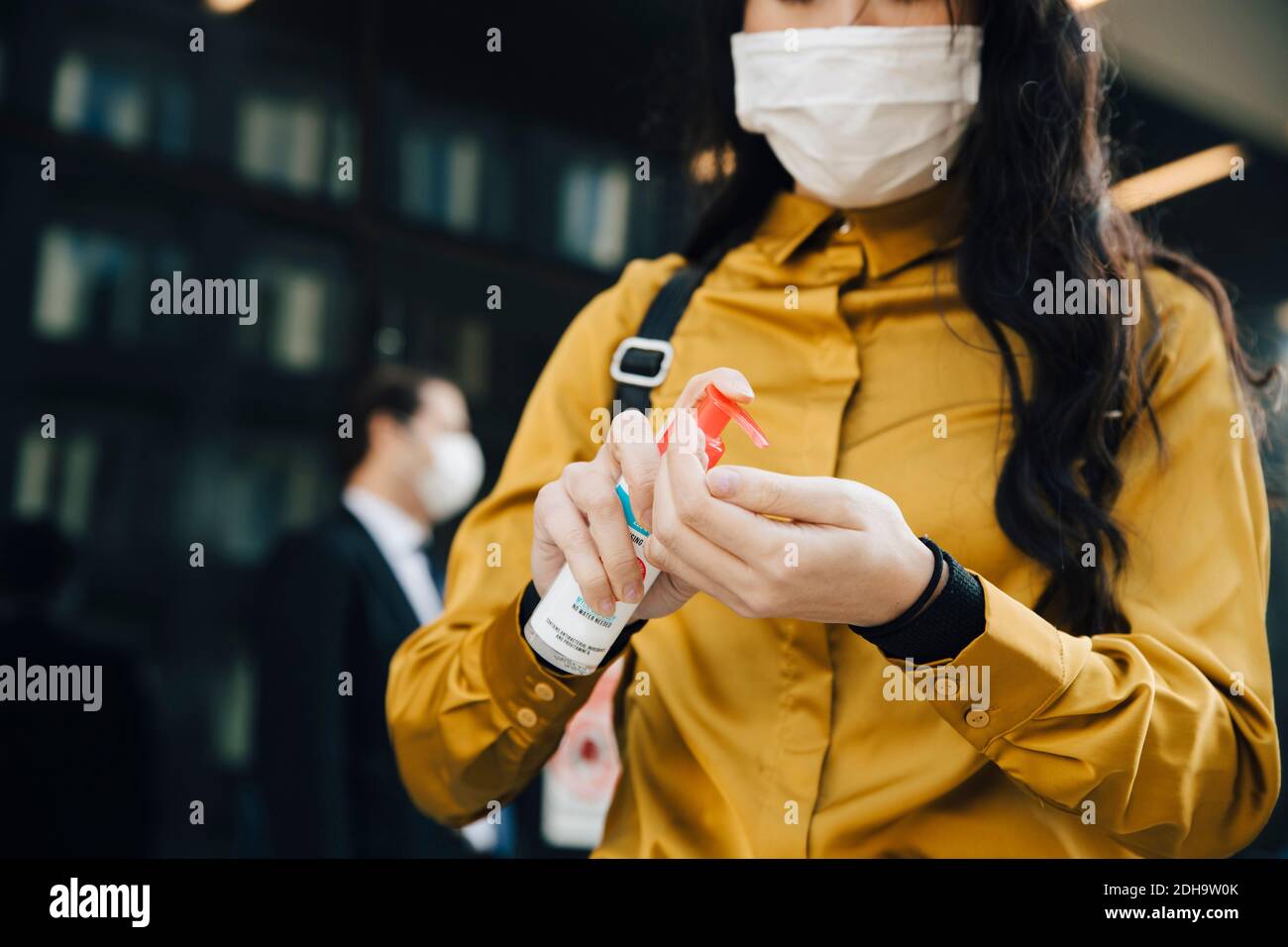 Woman outdoors applying sanitizer hi-res stock photography and images ...