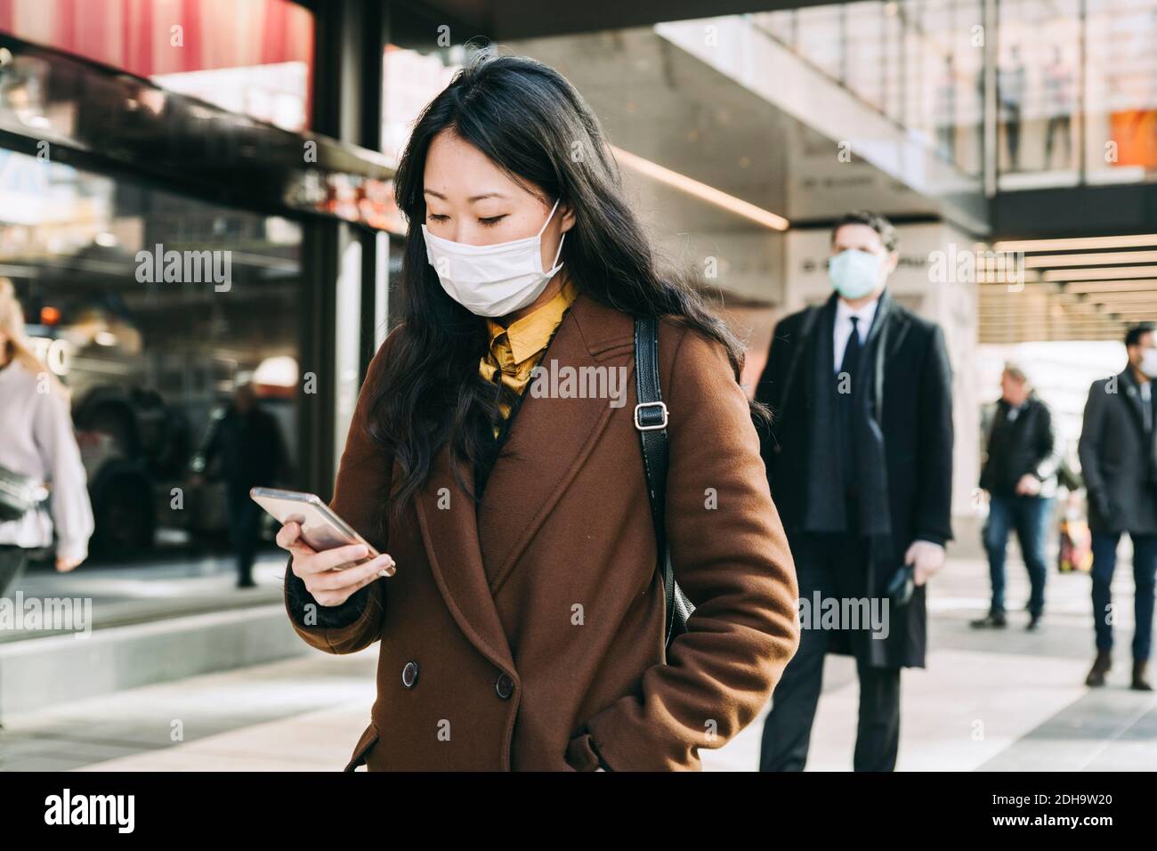 Woman walking using face hi-res stock photography and images - Alamy