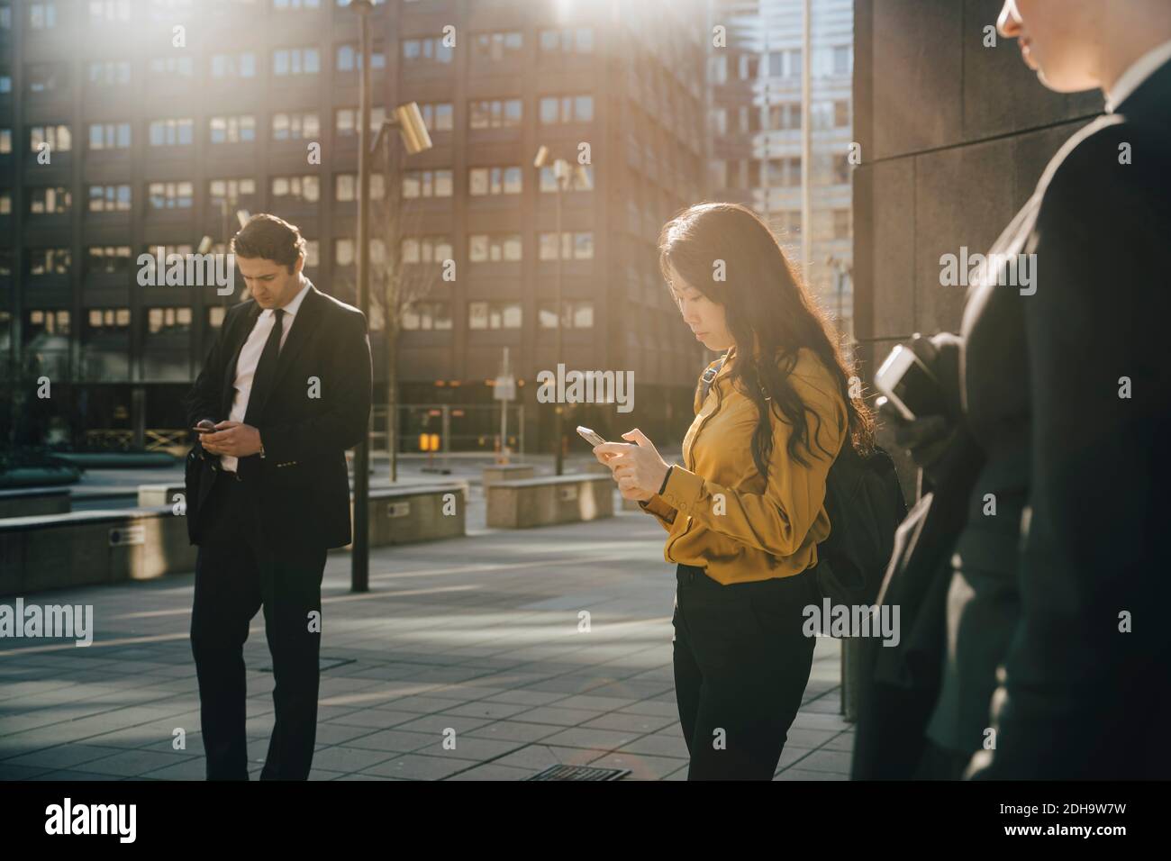 Business standing square hi-res stock photography and images - Alamy