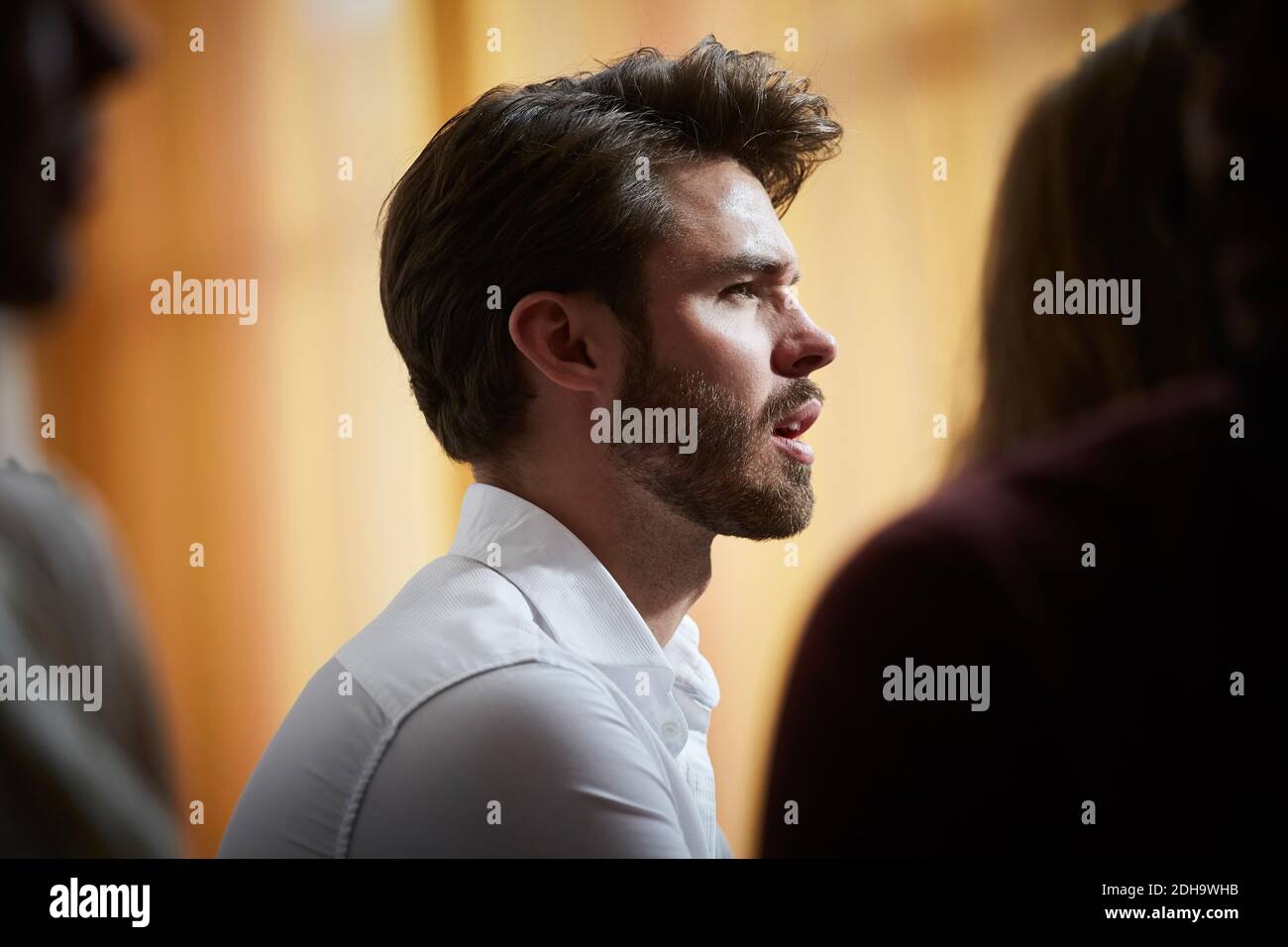 Side view of confused businessman looking away in office workshop Stock ...