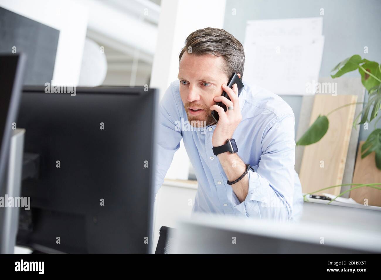 Adult businessman using computer hi-res stock photography and images ...