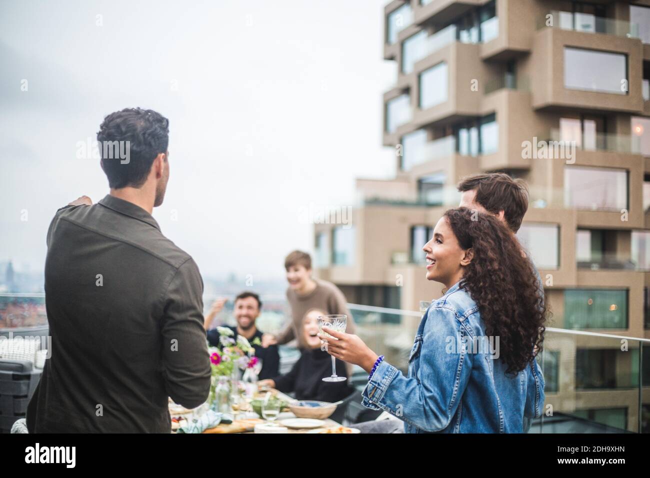 Group friends gathering on rooftop hi-res stock photography and images ...