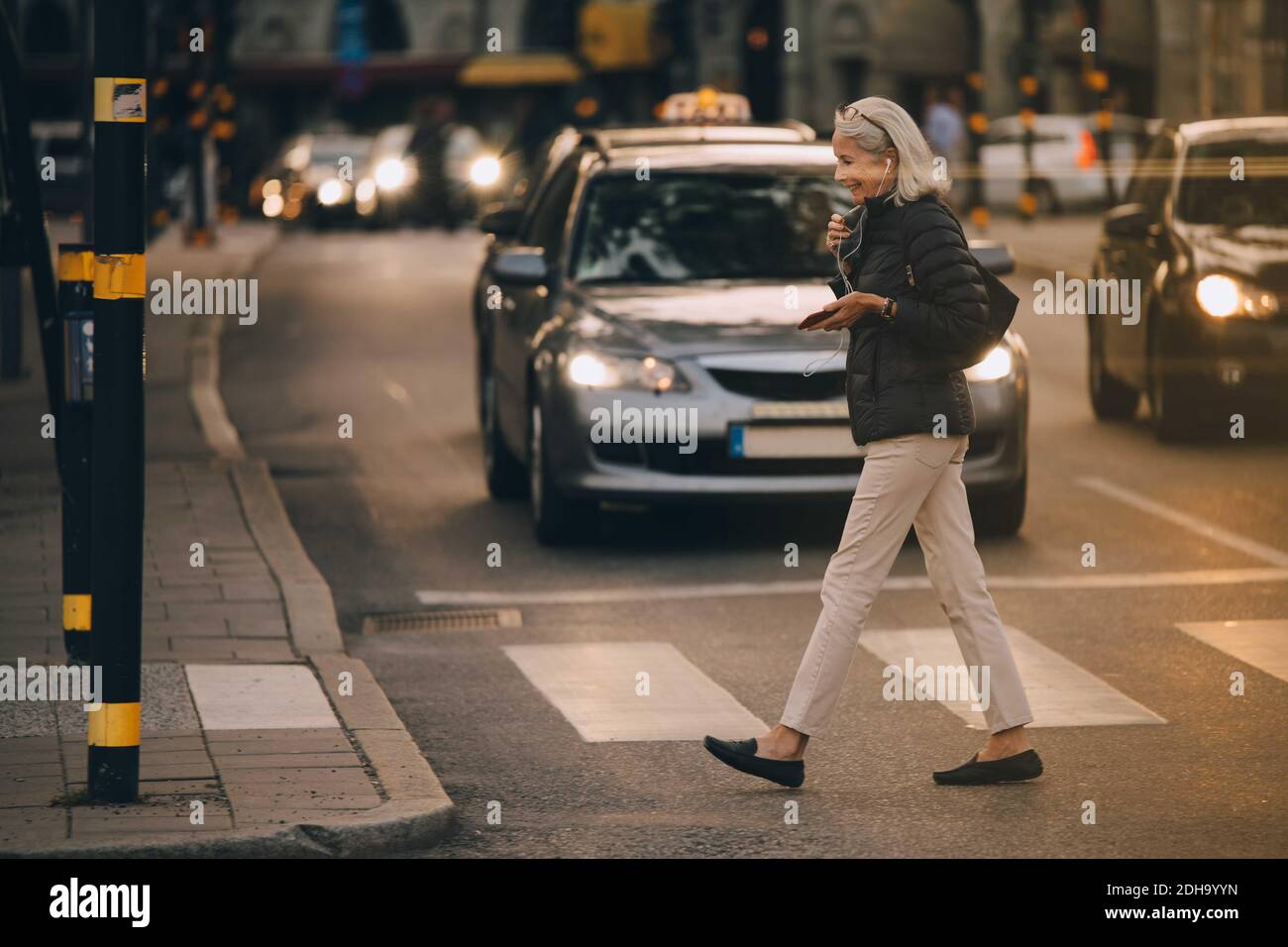 Old woman zebra crossing hi-res stock photography and images - Alamy