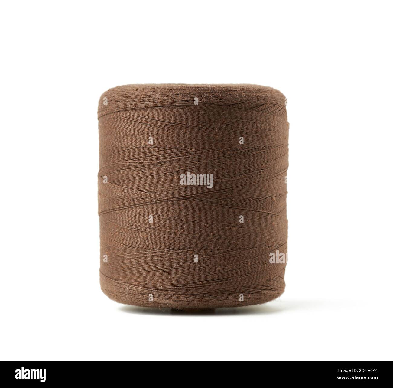 Large spool with brown cotton thread isolated on white background Stock ...