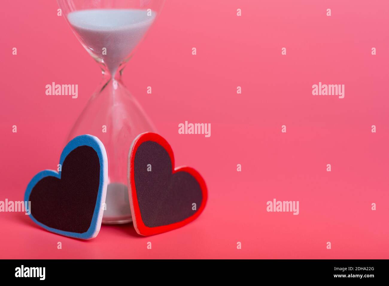 Two hearts hourglass on hi-res stock photography and images - Alamy