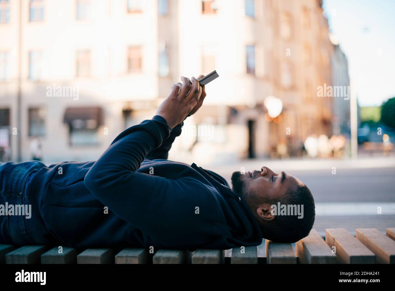 Man lying down bench hi-res stock photography and images - Alamy