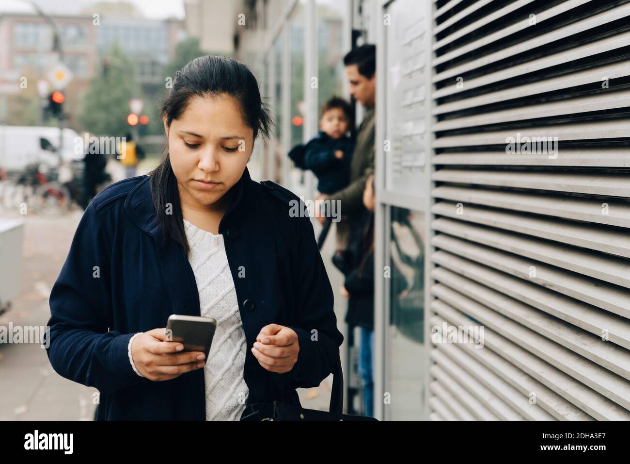 Woman on phone walking at home hi-res stock photography and images - Alamy