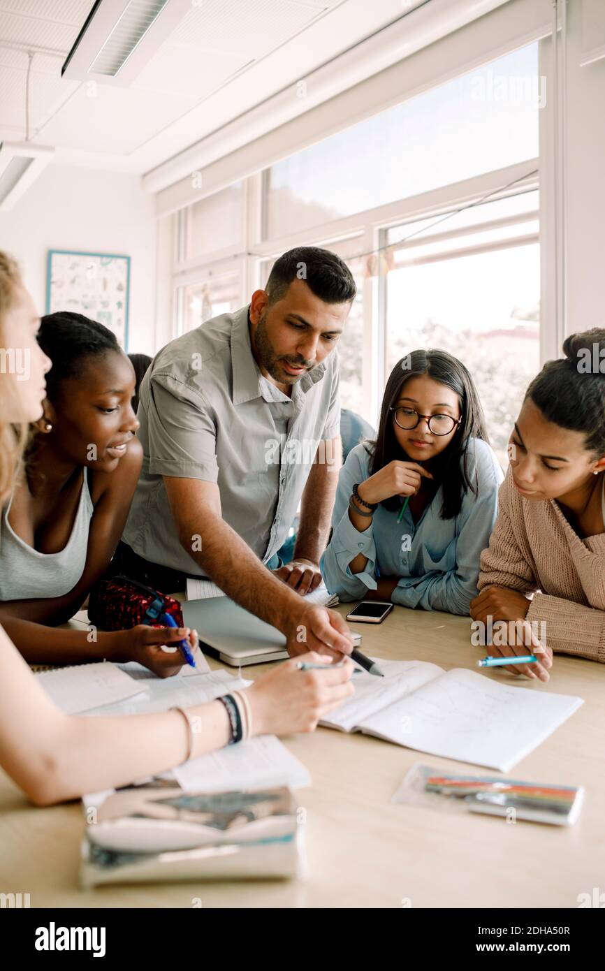 Multi ethnic teenagers in classroom hi-res stock photography and images ...
