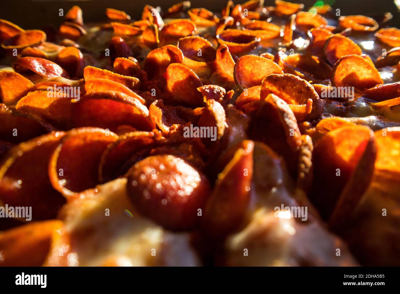 Messy Slices of Pepperoni Pizza on a tabletop Stock Photo - Alamy