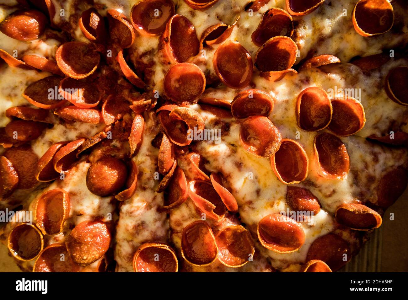 Messy Slices of Pepperoni Pizza on a tabletop Stock Photo - Alamy