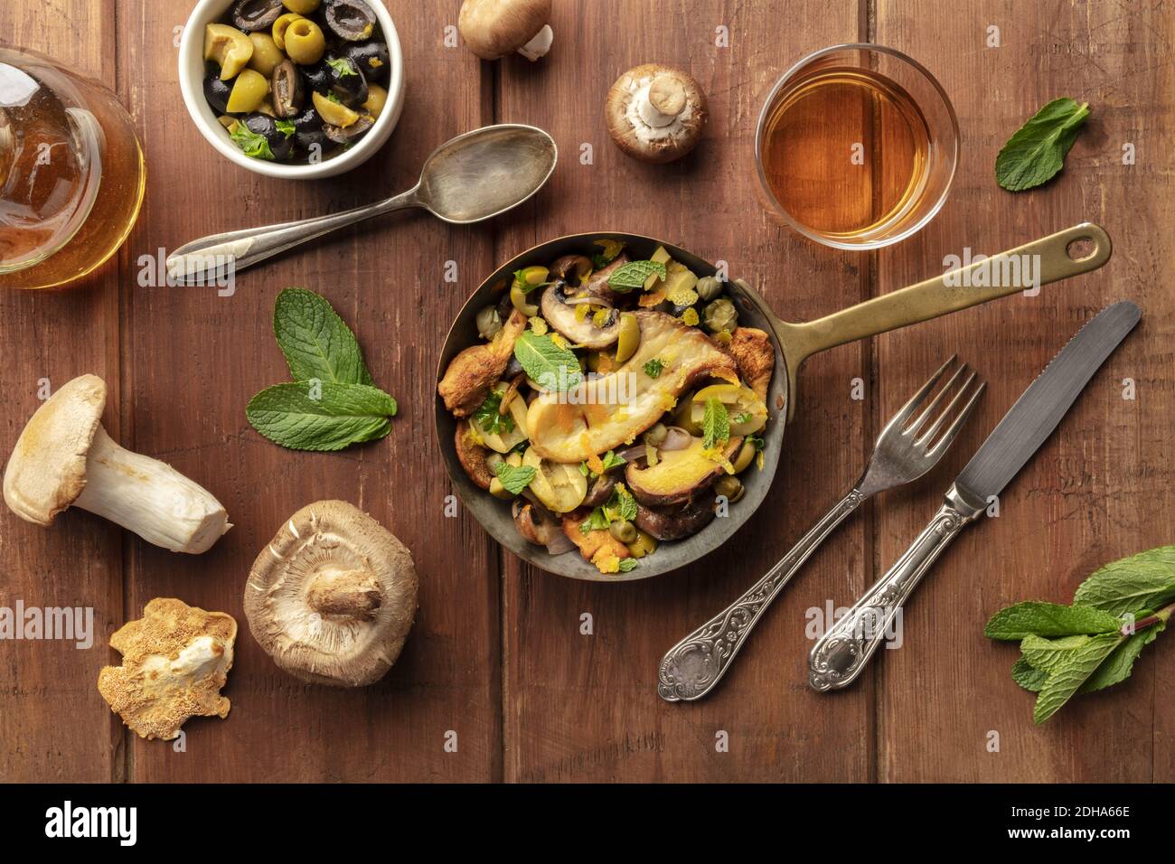 An overhead photo of a rustic mushrooms and olives saute with mint ...