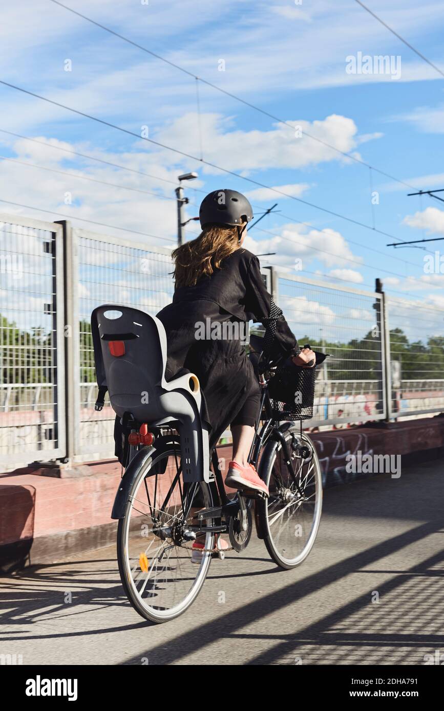Rear view women cycling on hi-res stock photography and images - Alamy