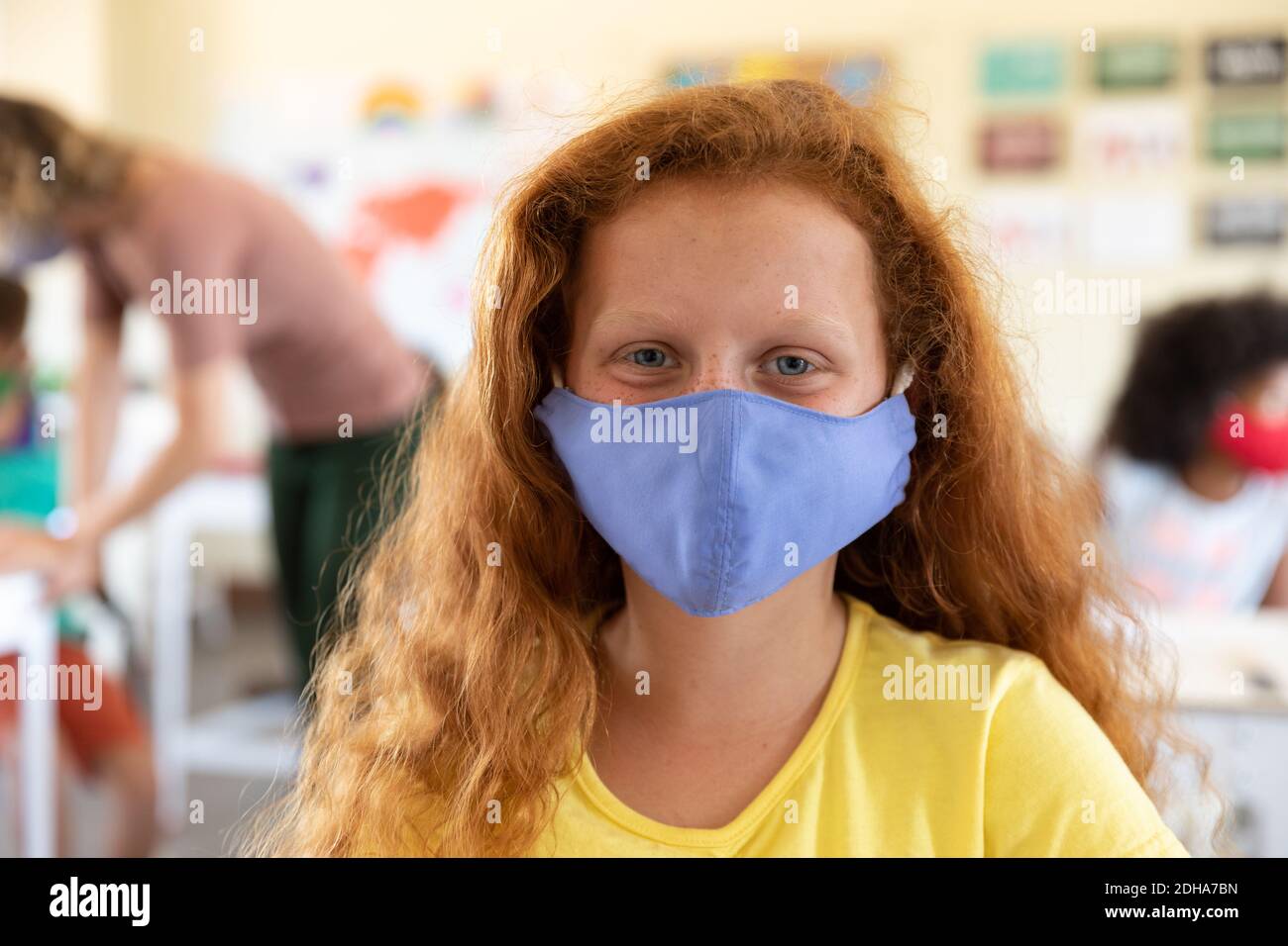 Portrait of girl wearing face mask at school Stock Photo - Alamy