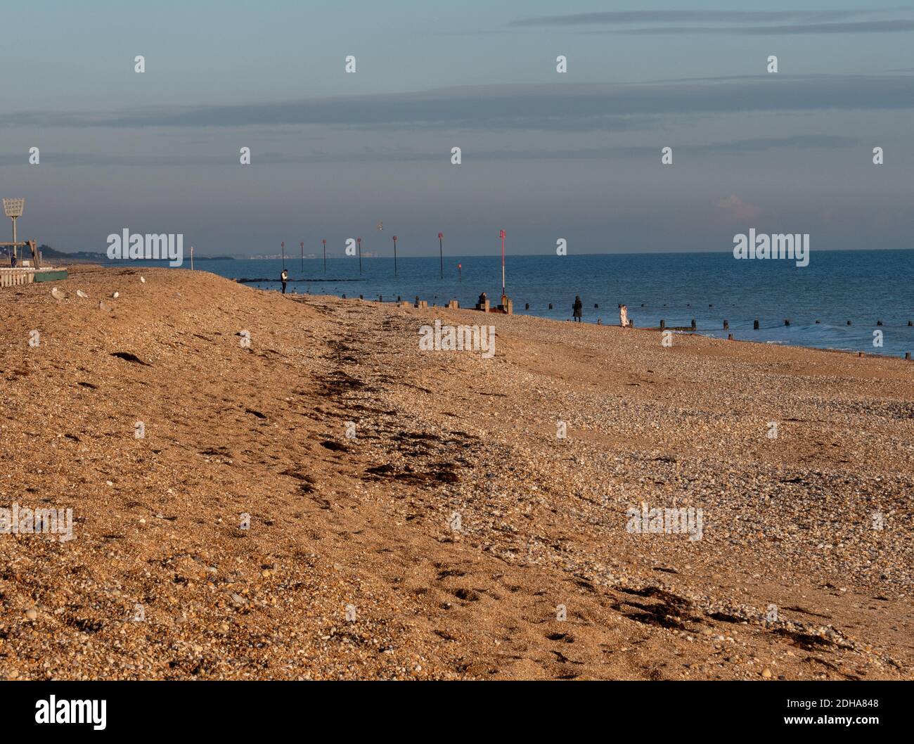 People seen walking on the beach of Bognor Regis on a sunny but cold ...