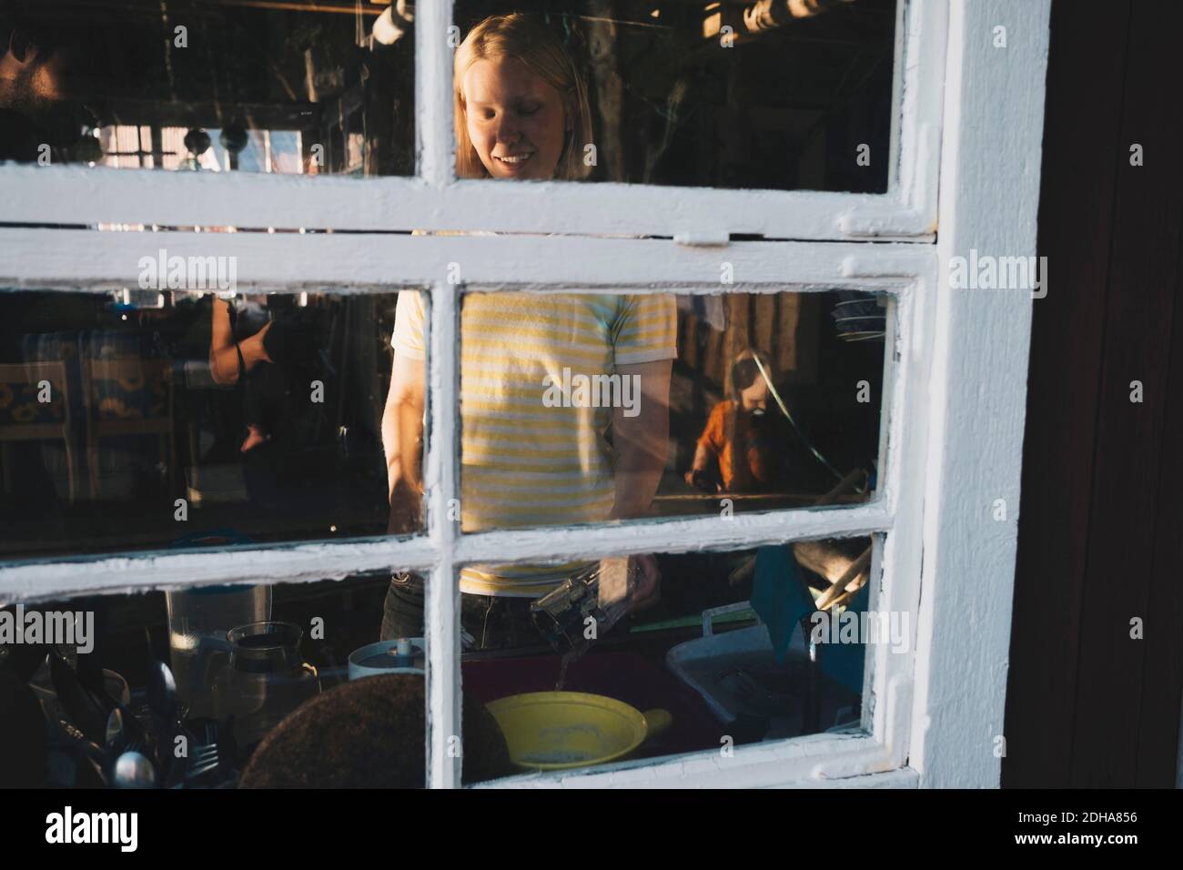 Smiling from window hi-res stock photography and images - Alamy