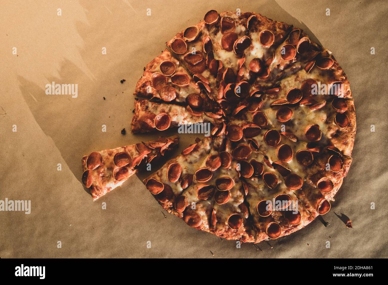 A Whole Pepperoni Pizza with a Slice removed Stock Photo - Alamy
