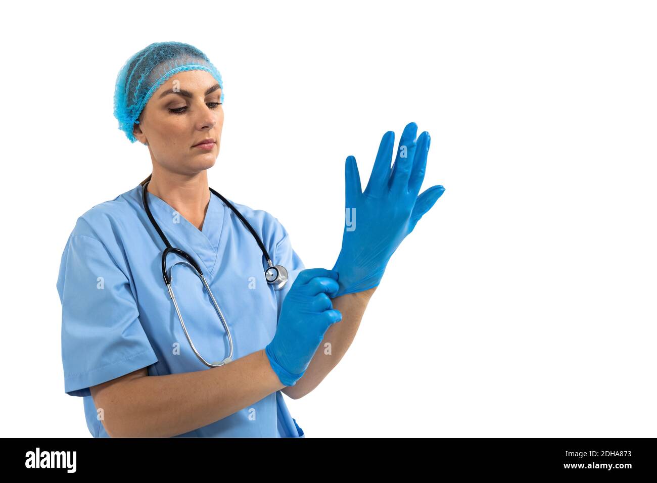 Female surgeon wearing protective gloves against white background Stock ...