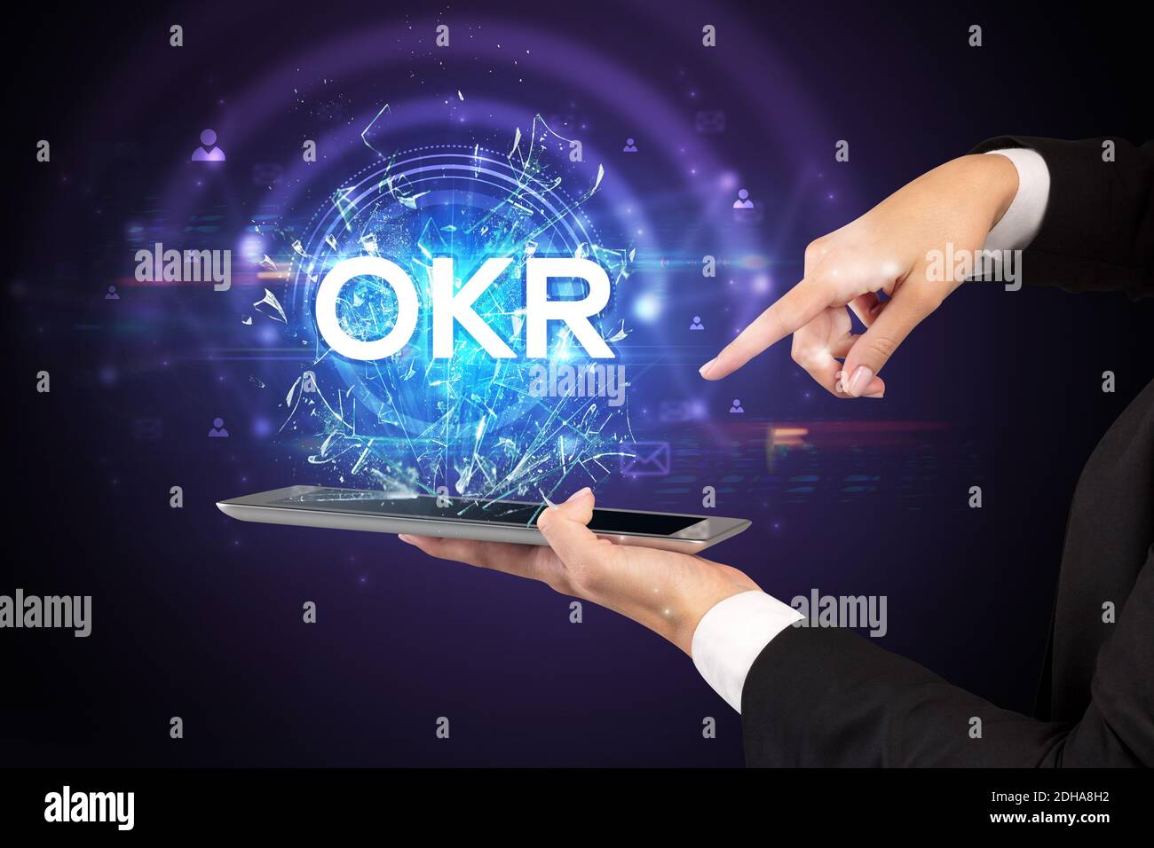 Close-up of a touchscreen with OKR abbreviation, modern technology ...