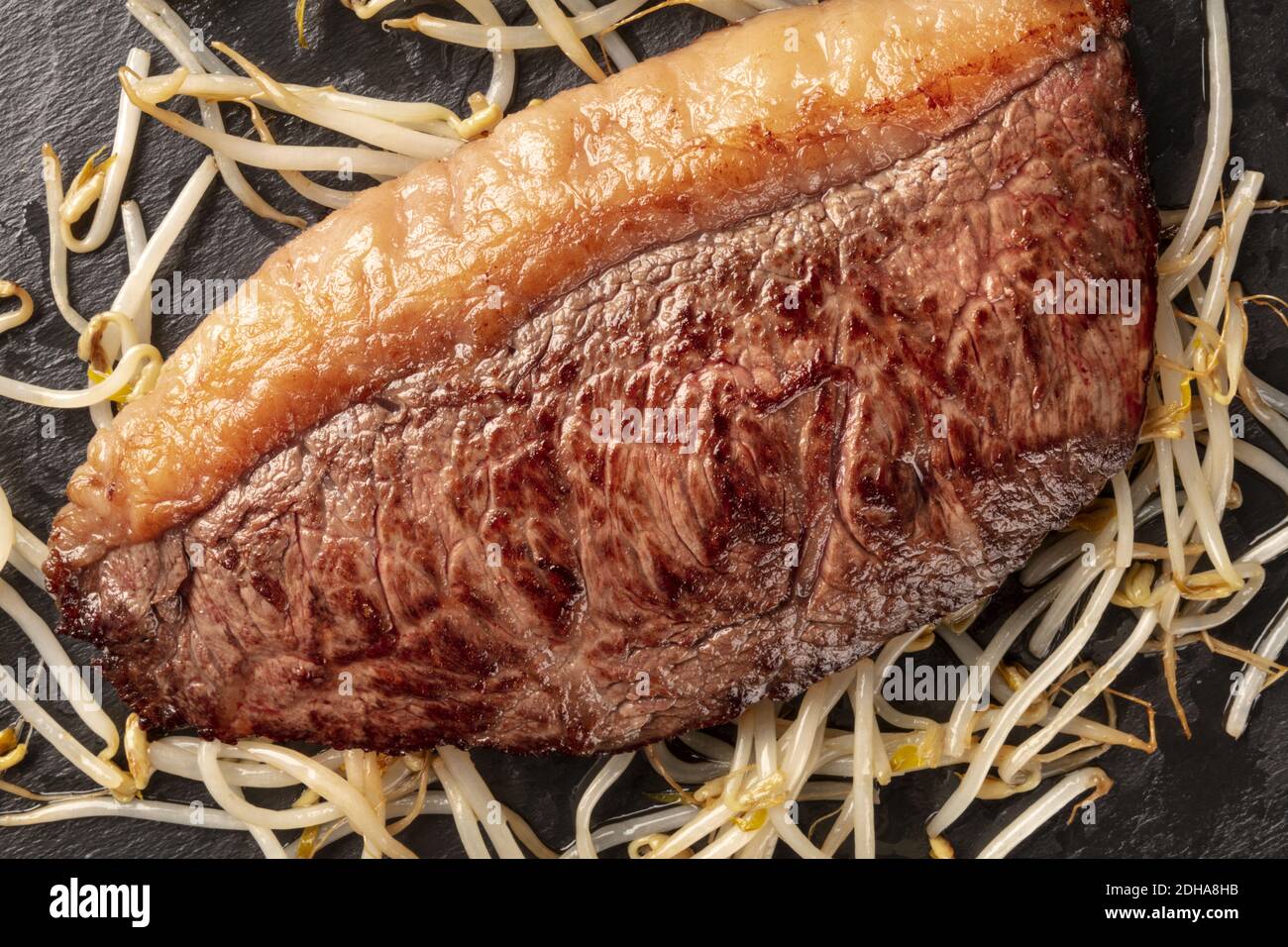 Kobe meat, wagyu beef steak, cooked, with soy sprouts Stock Photo - Alamy